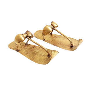 A pair of golden sandals found in King Tutankhamun’s tomb that shows ...