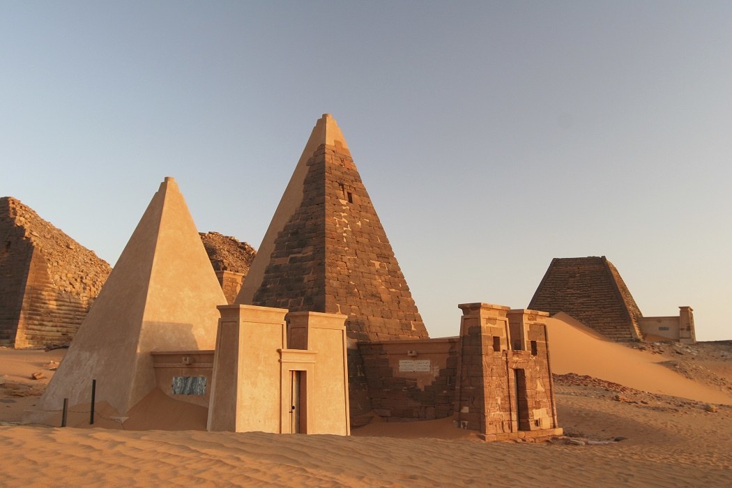 Ancient wall painting in the Nubian pyramids depicting a Giant carrying ...